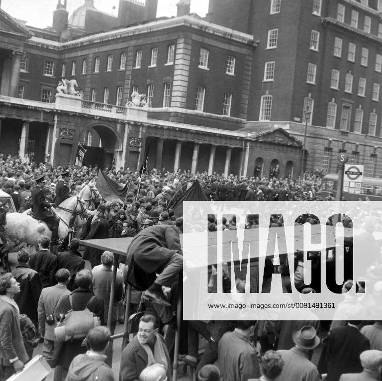 15 APRIL 1963 BAN THE BOMB DEMONSTRATORS CLIMB ONTO THE BUS SHELTER AT ...