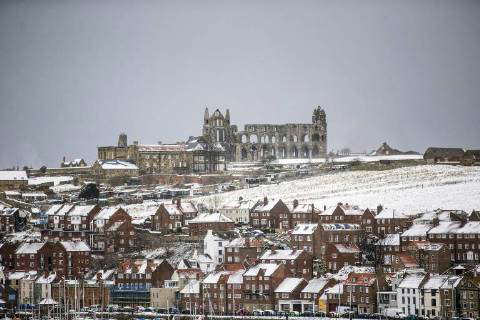 Whitby, Yorkshire, UK - Whitby UK. Whitby Abbey stands on the headland ...