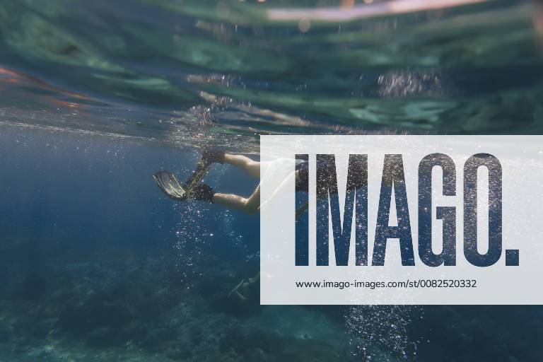 Underwater shot of man with fins and snorkeling model released Symbolfoto