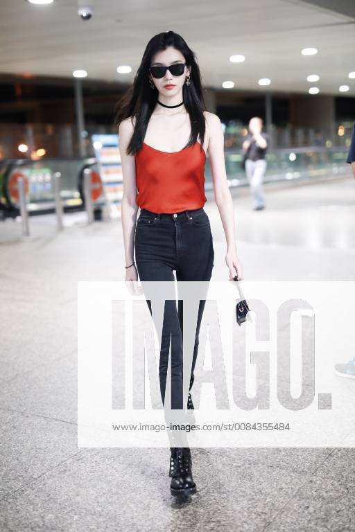 Chinese model Xi Mengyao, better known as Ming Xi, dresed in a sexy red camisole top and skinny