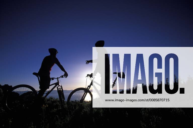 Todd Offenbacher and Brad Jackson take a break while mountain biking ...