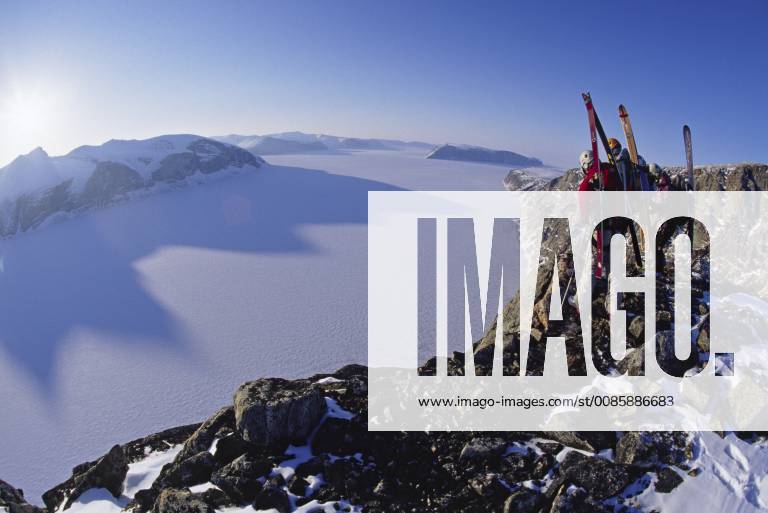 Skiers Kasha Rigby, and Hilaree O Neill, standing on the edge of a ...