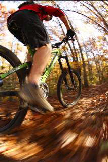 Bike mounted camera view of Adam Stephens riding his mountain bike ...