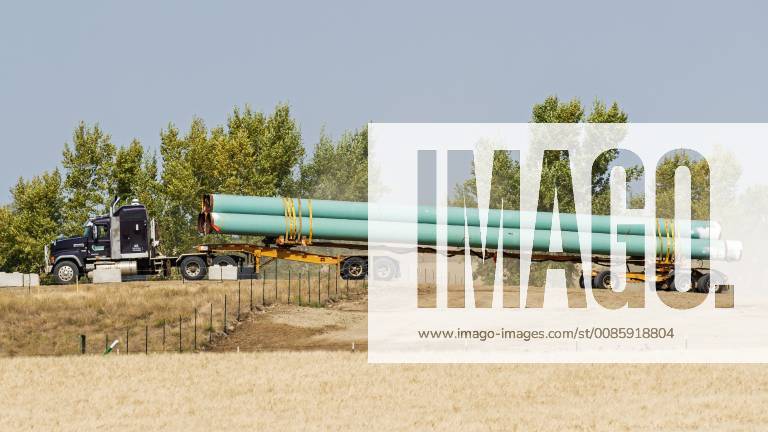 Shaunavon, Saskatchewan, Canada - Steel pipes are transported by a semi ...
