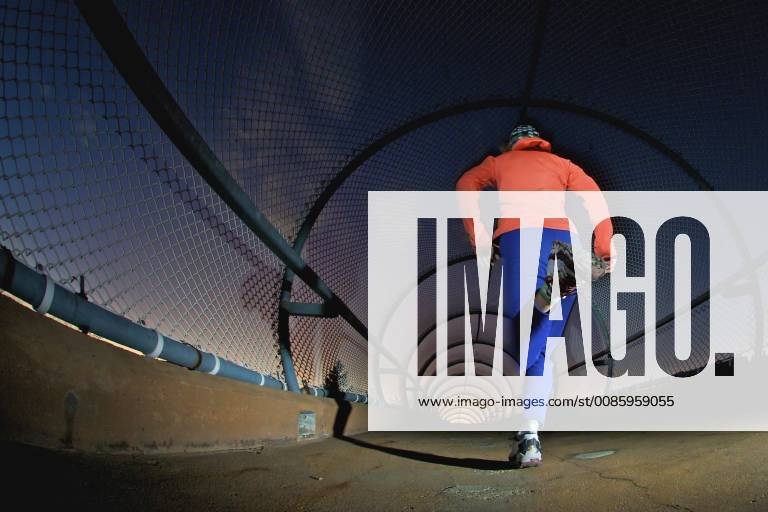 Kerry Cowan takes an evening run in Boulder, CO., Boulder Colorado USA ...