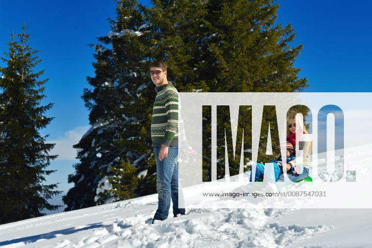 Winter season. Happy family having fun on fresh snow on vacation. model ...