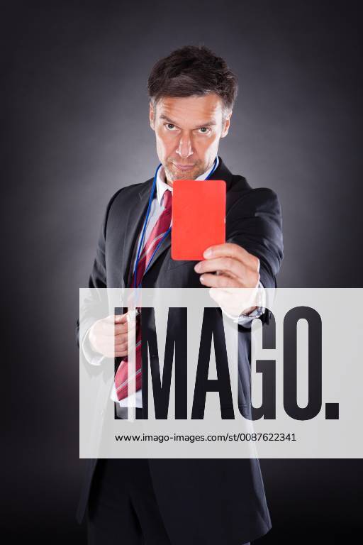 Portrait Of A Mature Businessman Showing Red Card Black Background ...