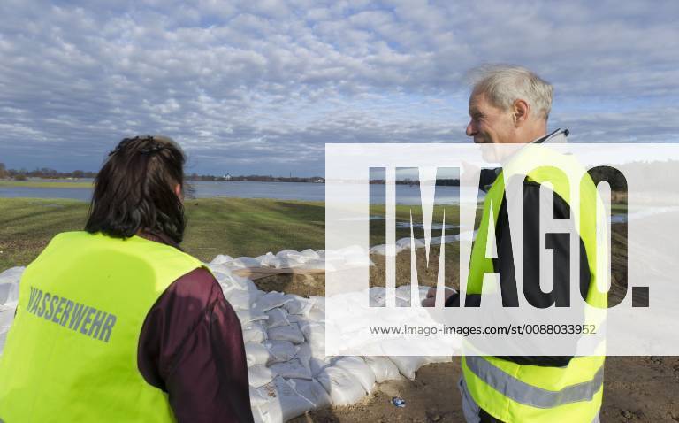 Nadine Fischer l and Hermann Rappold r check an emergency dike in ...