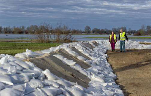 Nadine Fischer l and Hermann Rappold r check an emergency dike in ...