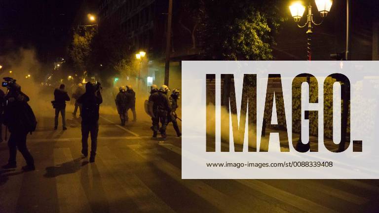 Athens, Greece - Riot Police officers are seen firing tear gas during ...