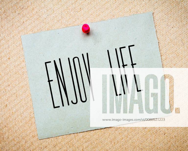 Recycled paper note pinned on cork board.Enjoy Life Message.Happiness ...