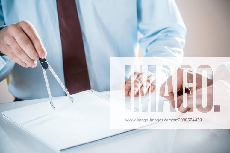 Architect with Compass and Notepad in Meeting