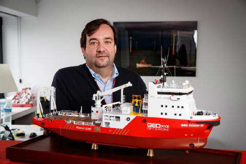 GEOxyz s CEO Patrick Reyntjens poses with a model boat, at the ...