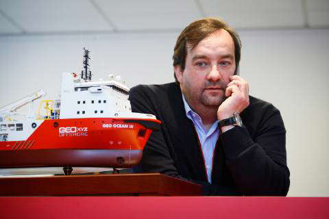 GEOxyz s CEO Patrick Reyntjens poses with a model boat, at the ...