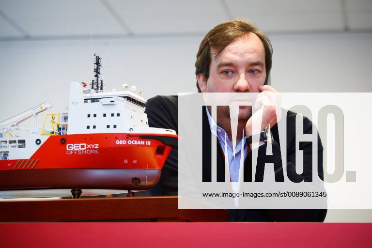 GEOxyz s CEO Patrick Reyntjens poses with a model boat, at the ...