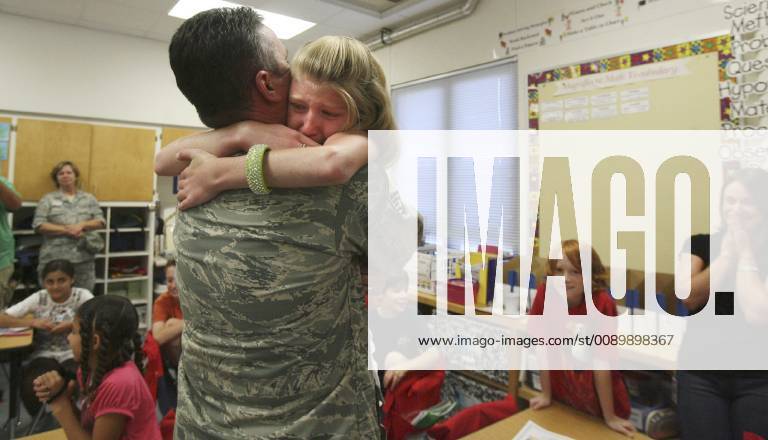 U.S. Air Force Master Sergeant Joe Myers greets his daughter Hannah ...
