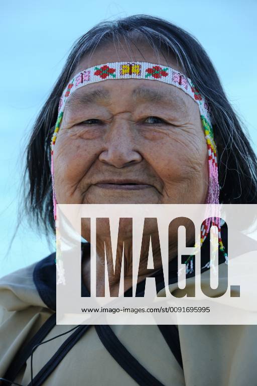 CANADA Head portrait of Portrait of Inuit shaman woman, wearing ...