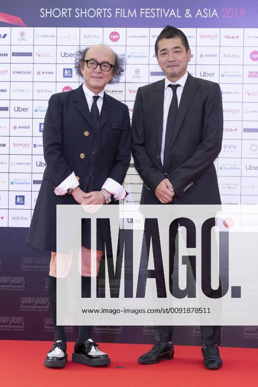 Tokyo, Japan - Magazine editor Masafumi Suzuki and Jun Kitada pose for ...