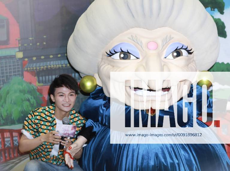 SHANGHAI, CHINA - JUNE 17: Singer Zhou Shen poses with animated ...