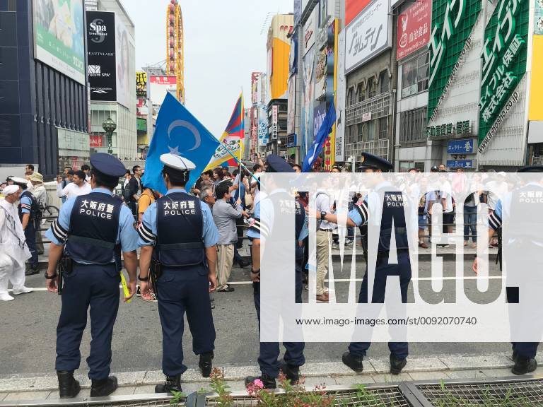 June 29, 2019 - Osaka, Japan - A group of police officers direct the ...