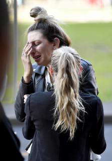 REECE WATHERSTON COURT, A woman reacts outside the Supreme Court in ...