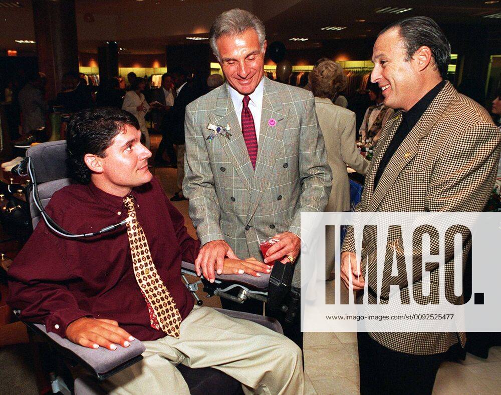 Miami, FL, USA: Mark Buoniconti and Nick Buoniconti talk with Dr. Barth ...