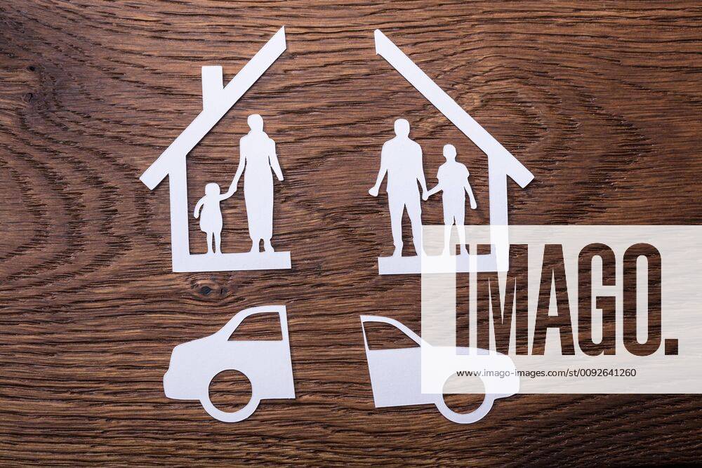 White Paper Cutout Of A Family Split Apart With Car