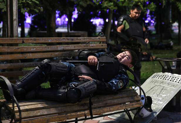 BISHKEK, KYRGYZSTAN - AUGUST 9, 2019: Riot police officers having rest ...