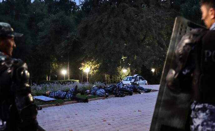 BISHKEK, KYRGYZSTAN - AUGUST 9, 2019: Riot police officers having rest ...