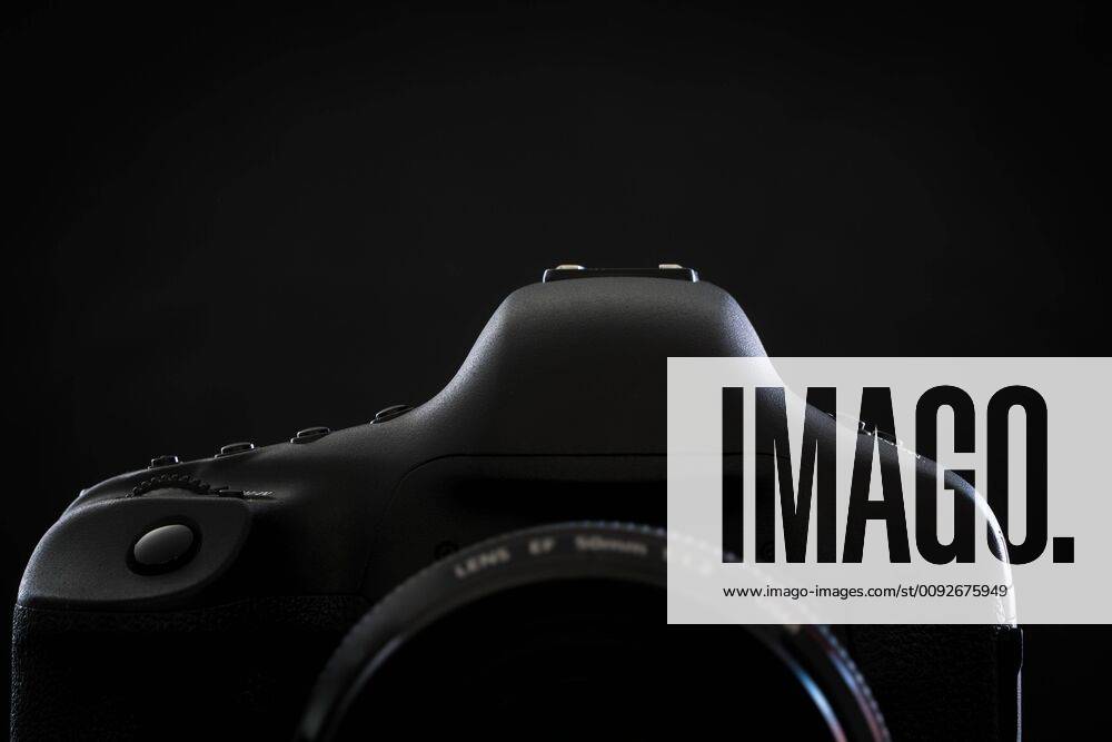 Professional modern DSLR camera low key image - Modern DSLR camera with ...