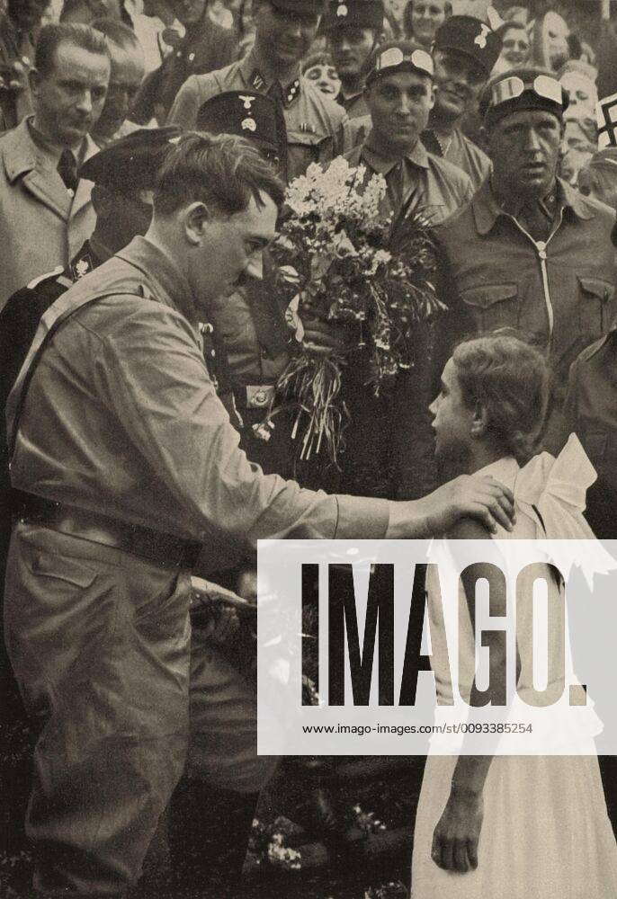 Hitler during his election campaign, 1933 Adolf Hitler greeting a young ...