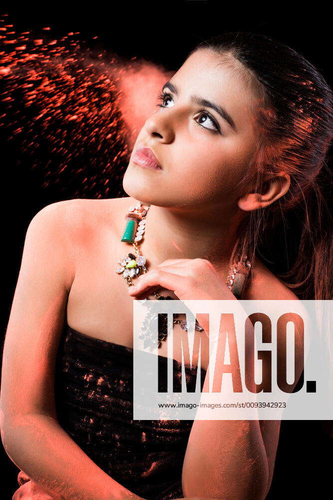 Girl with colored powder exploding around her, model released, Symbolfoto