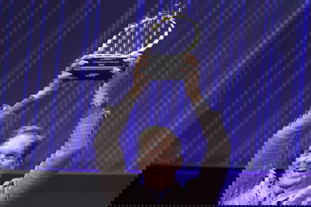 Salvatore Curaba, CEO of EASI holds up his trophy during the award ...