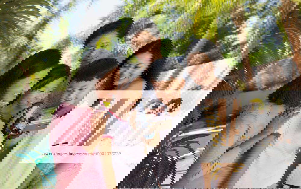 Family Looking at Video Camera Screen,model released, Symbolfoto ...