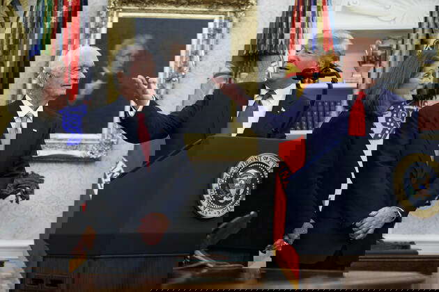 American racing magnate Roger Penske (R) and his wife Kathy Penske (L ...