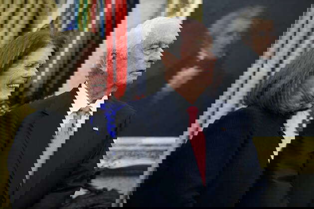 American racing magnate Roger Penske (R) and his wife Kathy Penske (L ...