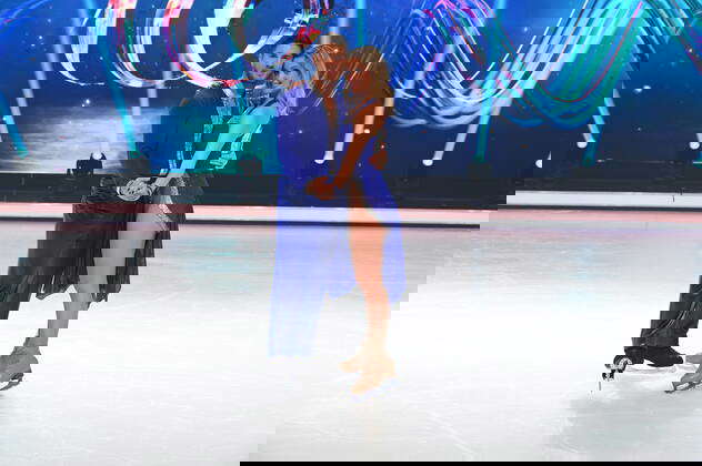 Joey Heidle and Ramona Elsener posing on the ice rink at a press event ...