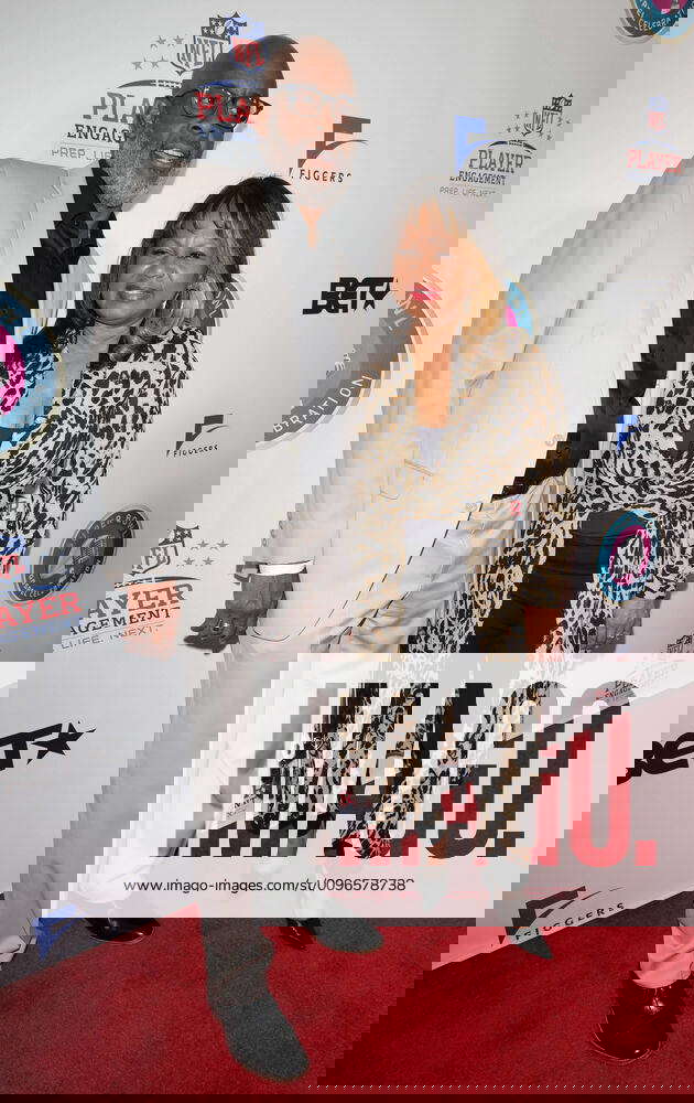 Marcus A. Riggins and Brenda L. Hill Riggins walk the red carpet during ...