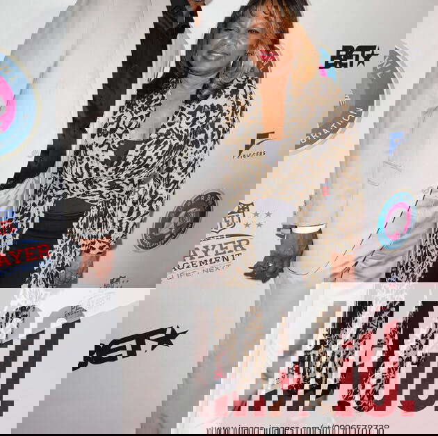 Marcus A. Riggins and Brenda L. Hill Riggins walk the red carpet during ...