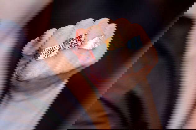 Actress Juliane Elting with me too and Time s Up Ring shows middle ...