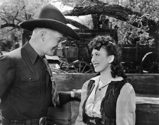 THE VIRGINIAN, Lee J. Cobb gives co-star Diane Roter his autograph on ...