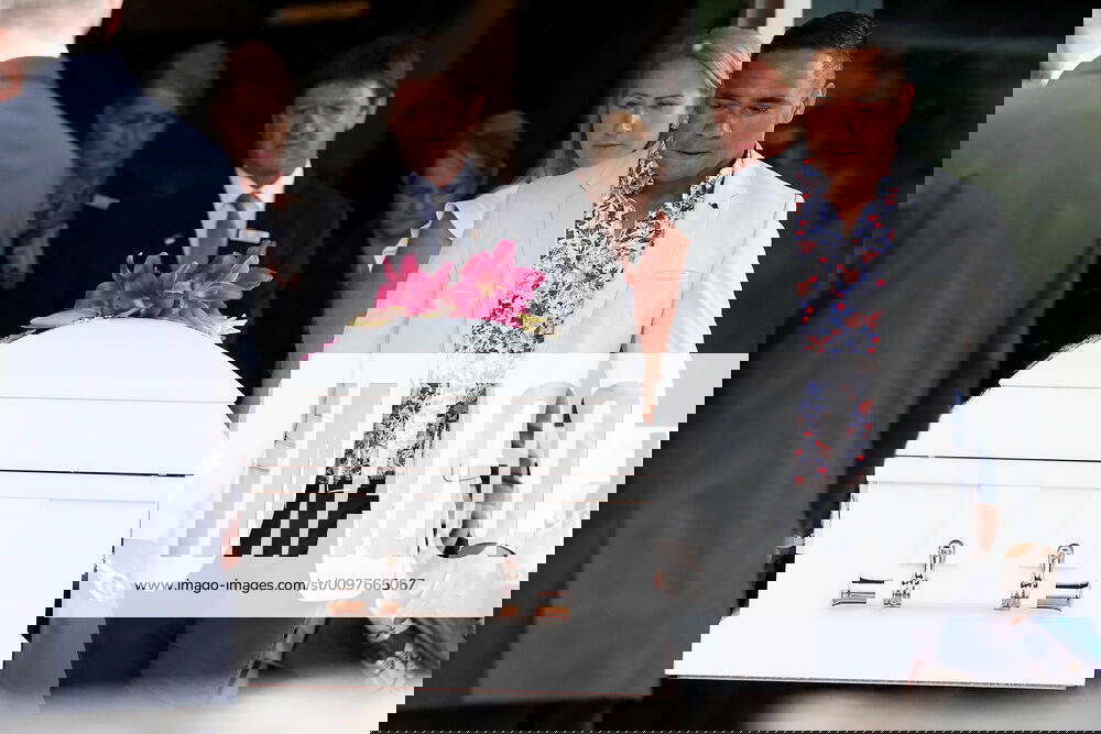 CLARKE FAMILY FUNERAL, Pall bearers carry the coffin, carrying all four family members, during the