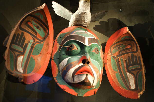 A carving of a face, mask inside the National Museum of the American ...