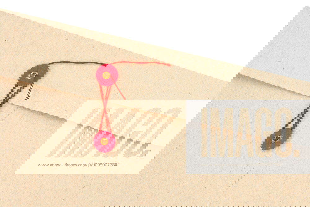 Envelope with red string Closeup of interoffice envelope with red string