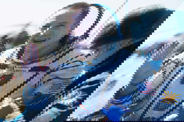 KAZAKHSTAN – : US astronaut Andrew Morgan of NASA speaks on the phone ...