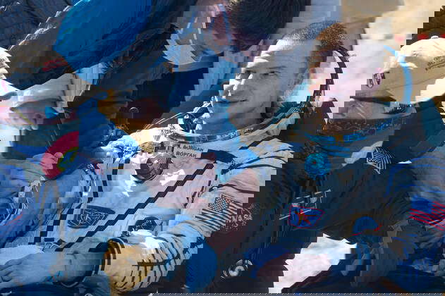 KAZAKHSTAN – : US astronaut Andrew Morgan of NASA speaks on the phone ...