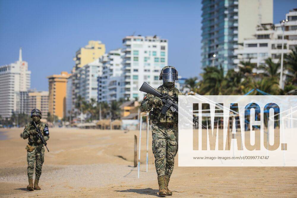 Agents of the Mexican Marine Corps patrol a beach due to the COVID-19 ...
