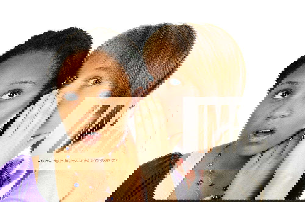 Two girlfriends gossiping Isolated portrait of two diverse teenage girl ...