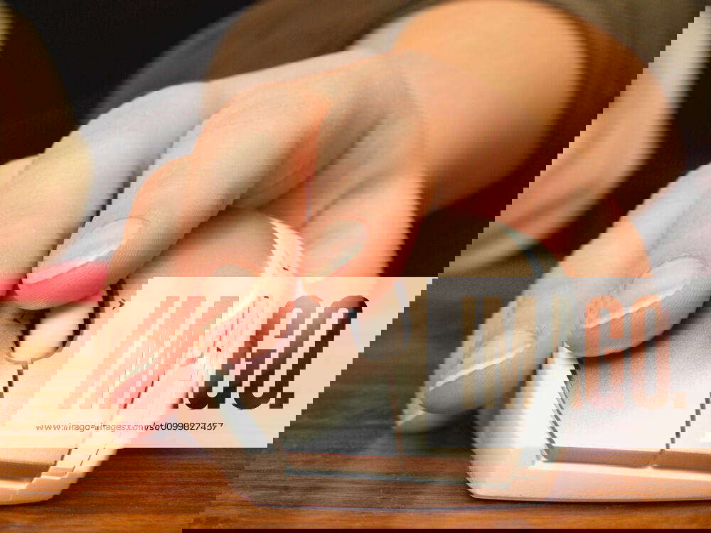 Human hand using scroll wheel on computer mouse Human hand using scroll ...