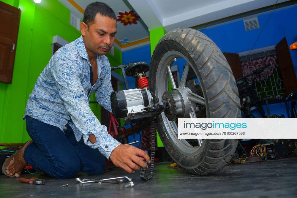 Partha Saha, a self-taught automotive engineer, assembles his electric ...